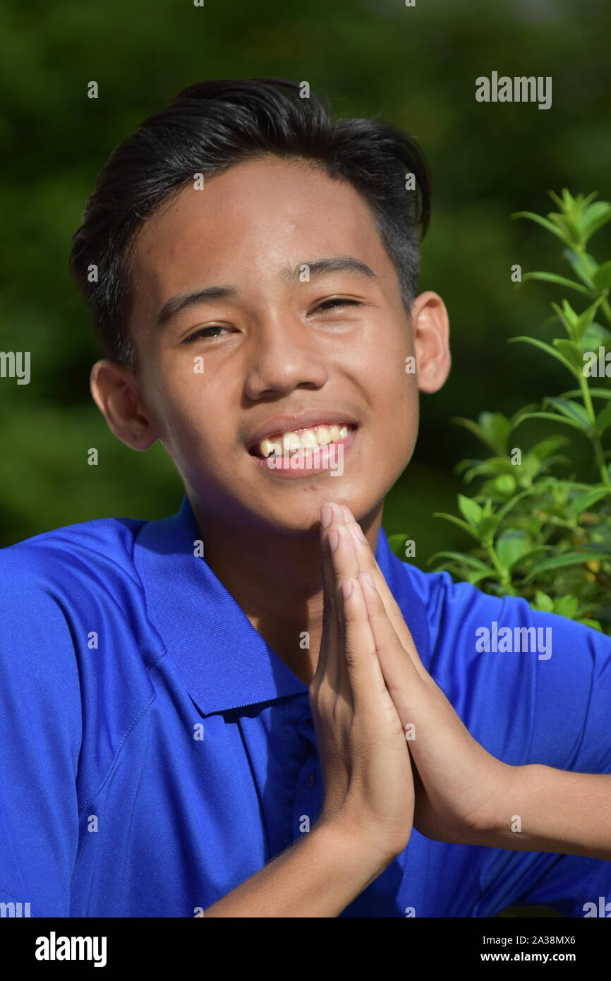 A Good Looking Boy Praying Stock Photo - Alamy