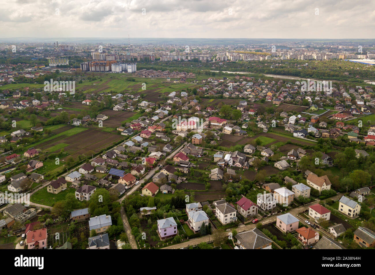 Aerial landscape of small town or village with rows of residential ...