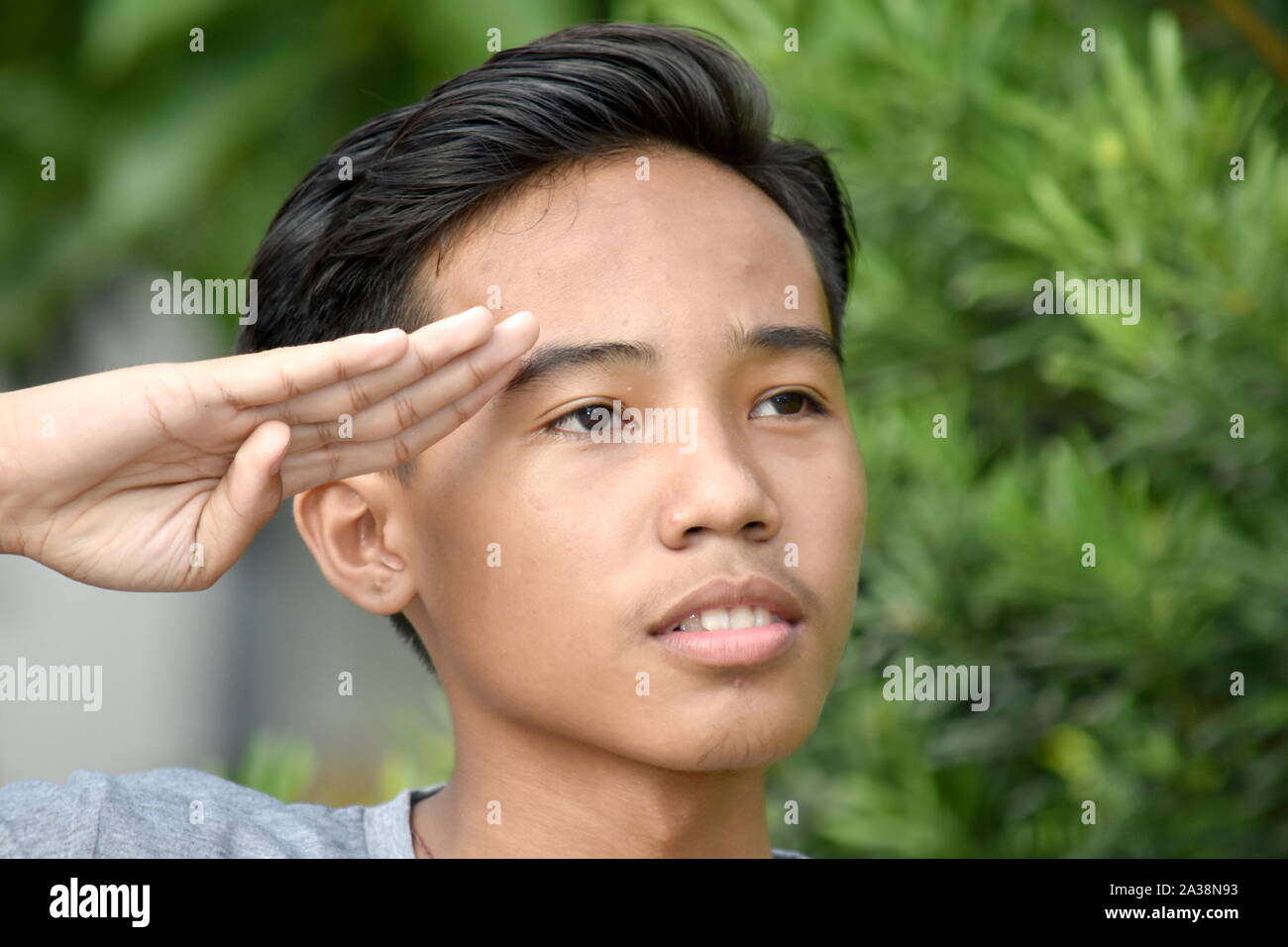 An A Teenager Boy Saluting Stock Photo - Alamy