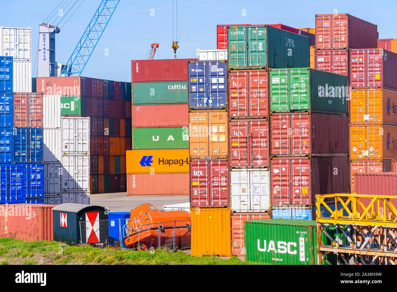 Shipping containers stacked up in the port of Rotterdam, Netherlands ...