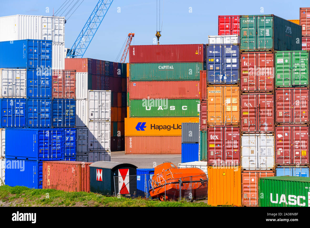 Shipping containers stacked up in the port of Rotterdam, Netherlands ...
