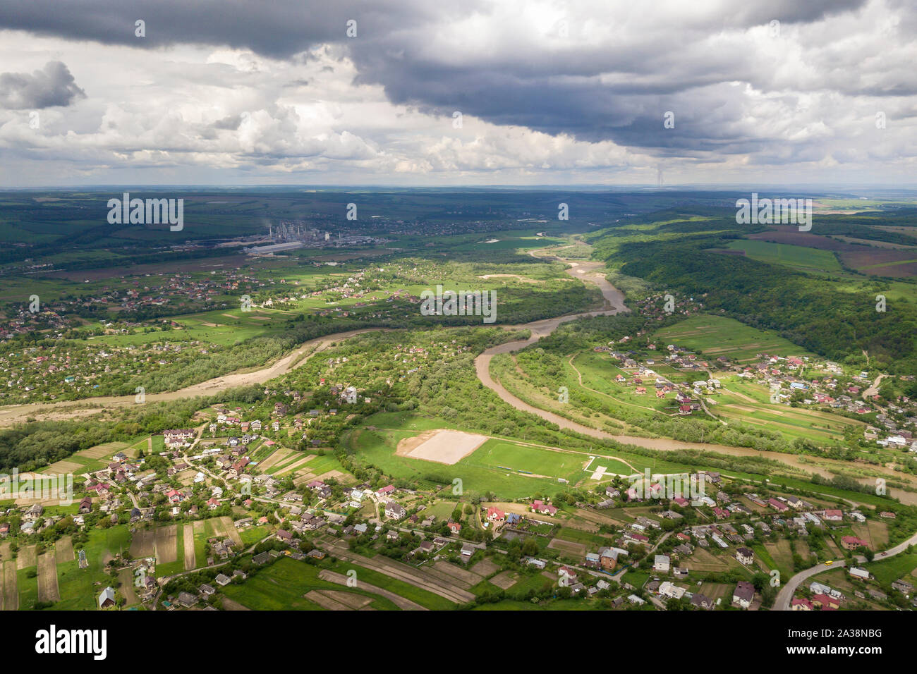 Top down aerial view of town or village with rows of buildings and ...
