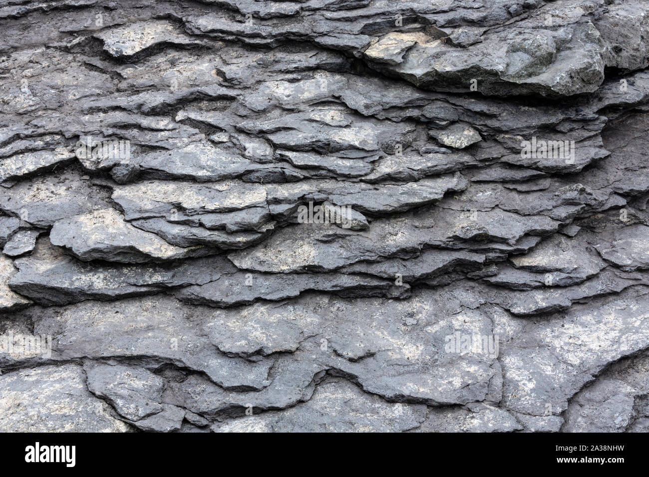 Grey coastal rocks - background with rough texture Stock Photo - Alamy
