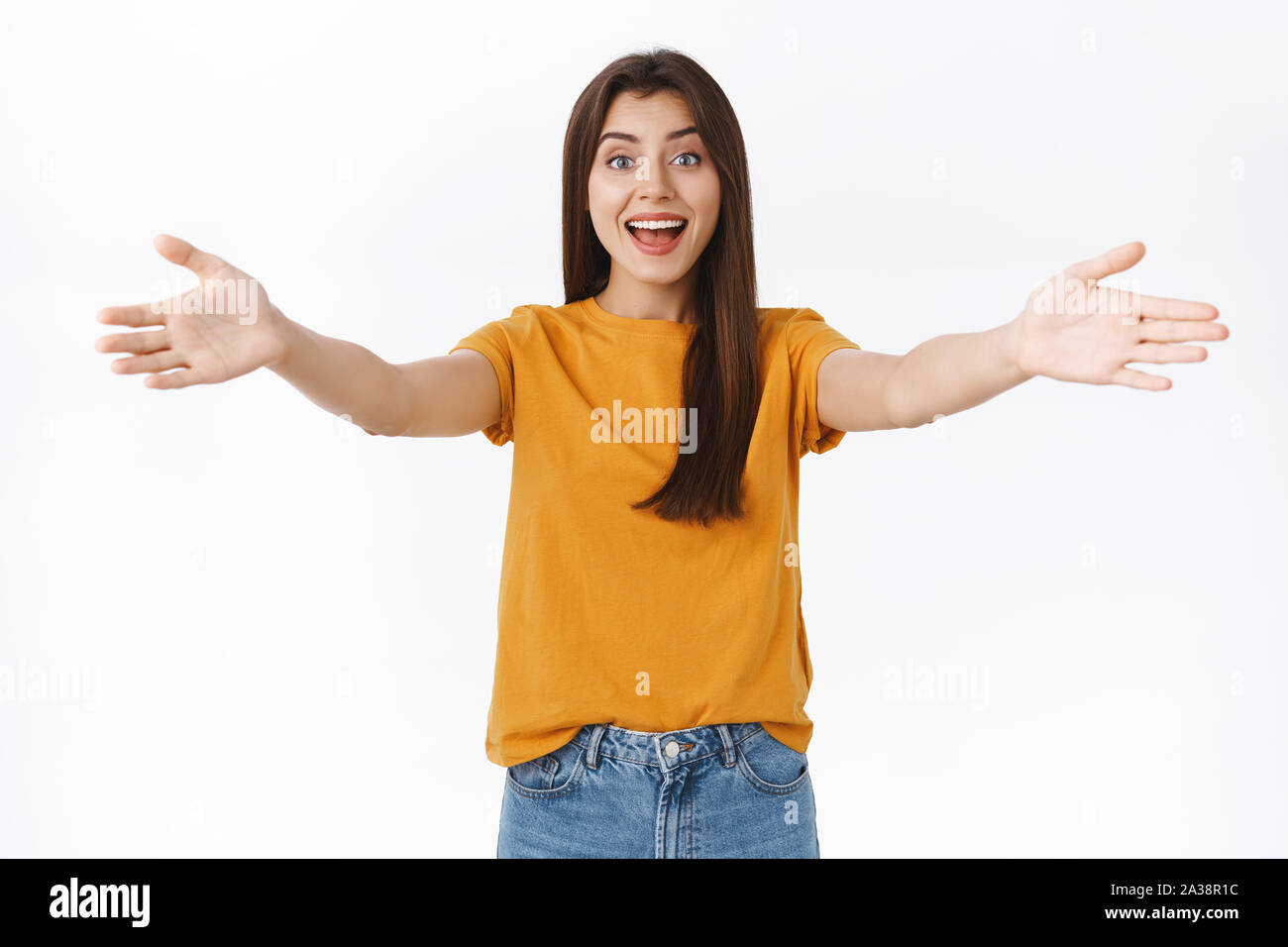 Friendly, carefree outgoing woman see familiar face in crowd, spread ...