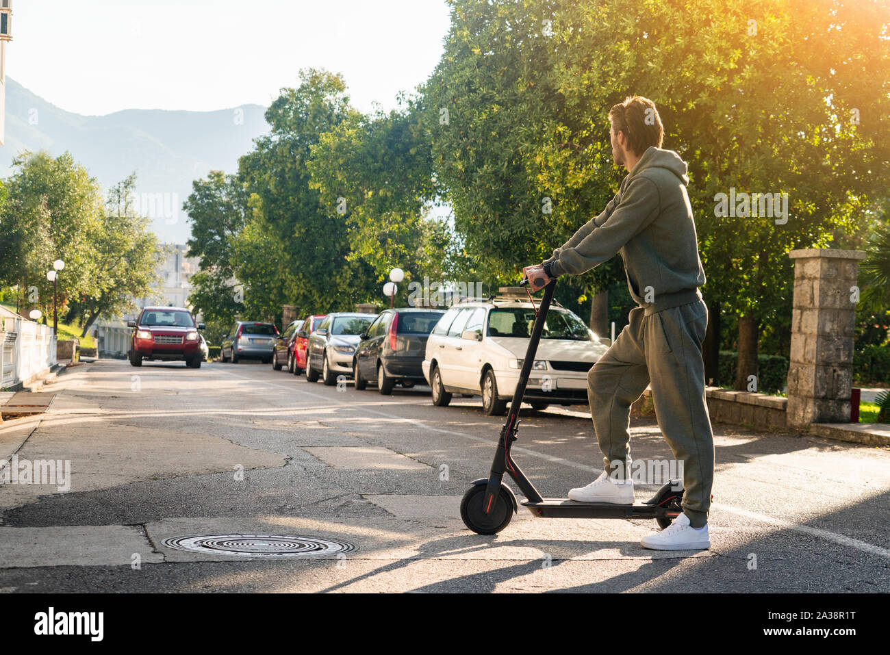 Man scooter on street hi-res stock photography and images - Alamy