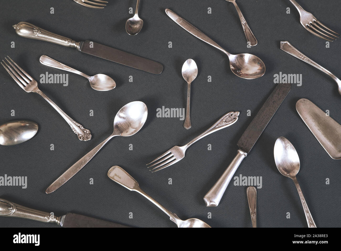 Vintage silverware on gray background Stock Photo - Alamy