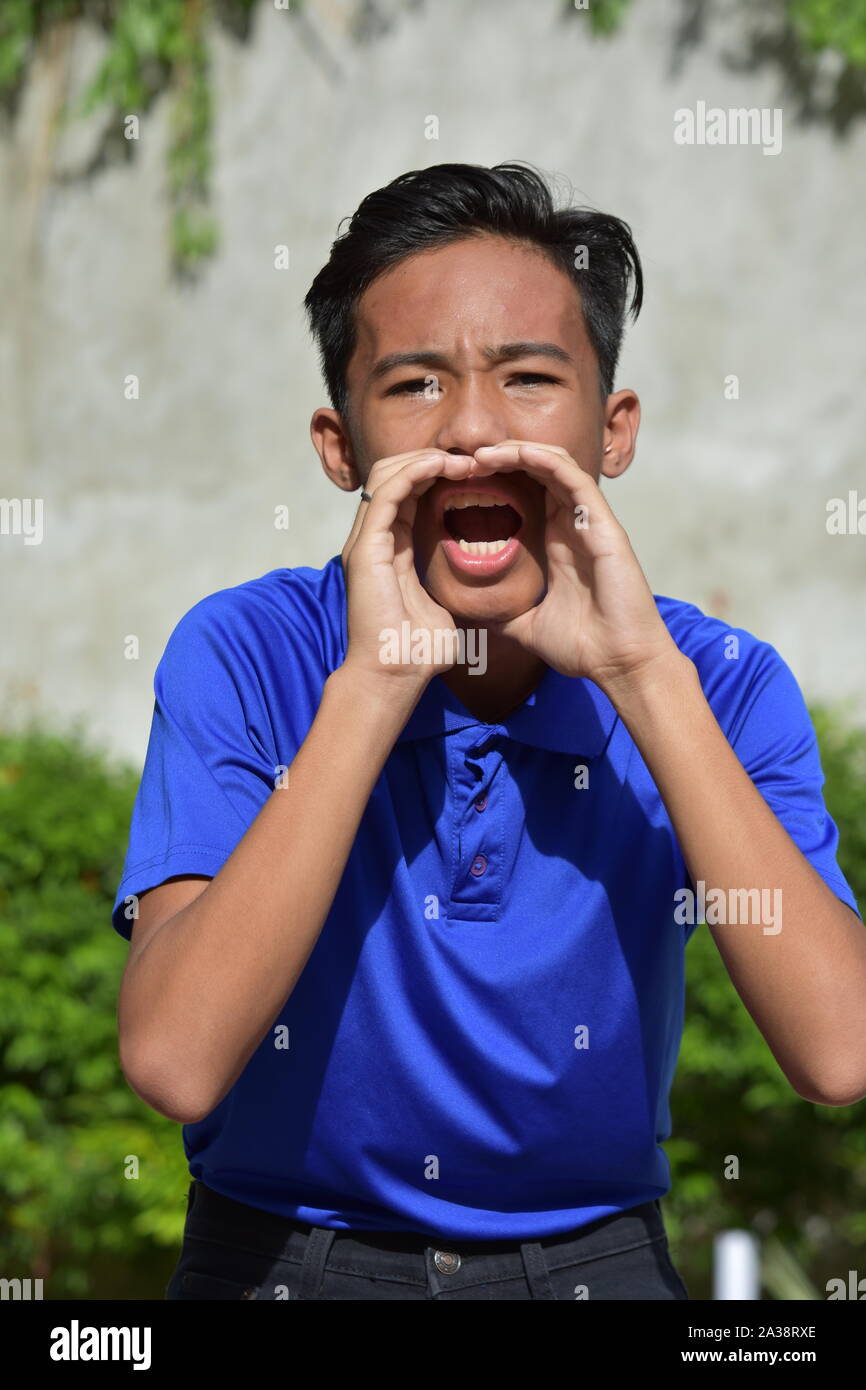 A Shouting Minority Teen Boy Stock Photo - Alamy