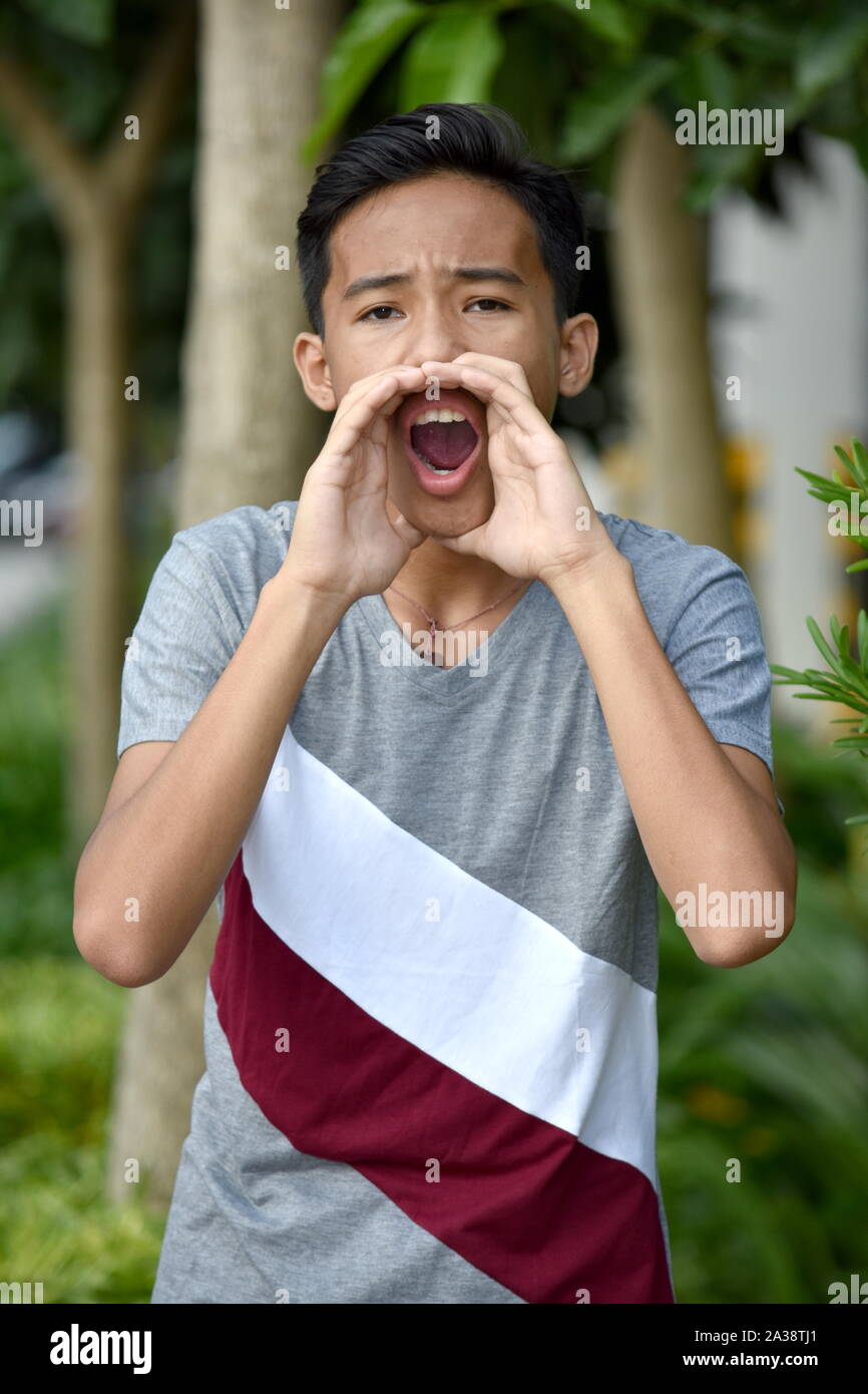 A Young Filipino Male Yelling Stock Photo - Alamy