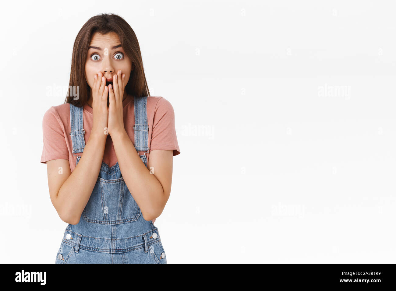 Shocked worried and concerned young woman hearting devastating news ...