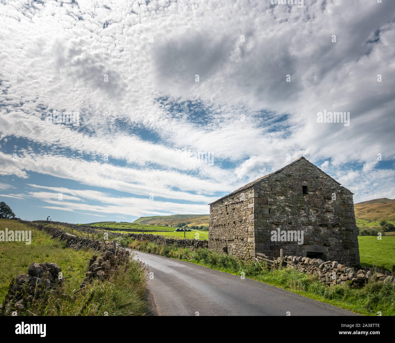 Old Yorkshire stone barn in Mallerstang Dale with Wild Boar Fell behind ...