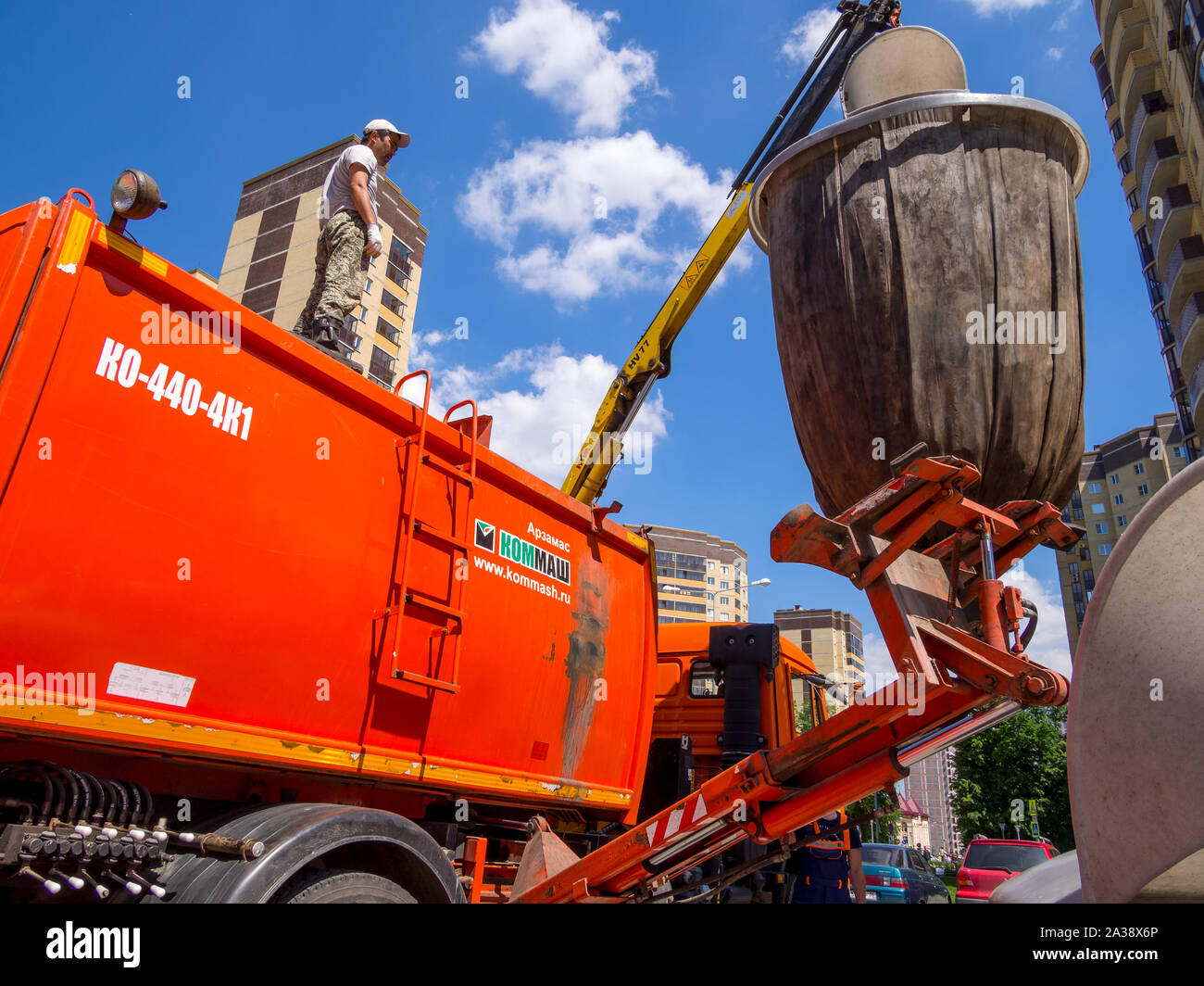 Voronezh, Russia - May 28, 2019: Garbage container is unloaded using a ...