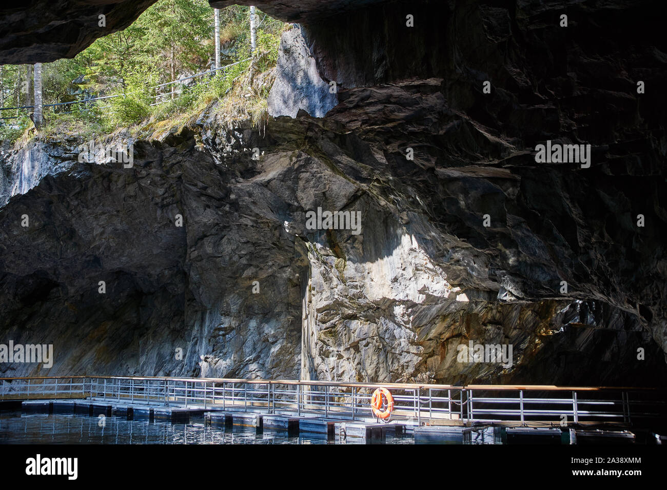 Types of a former underground marble quarry flooded with water. The ...