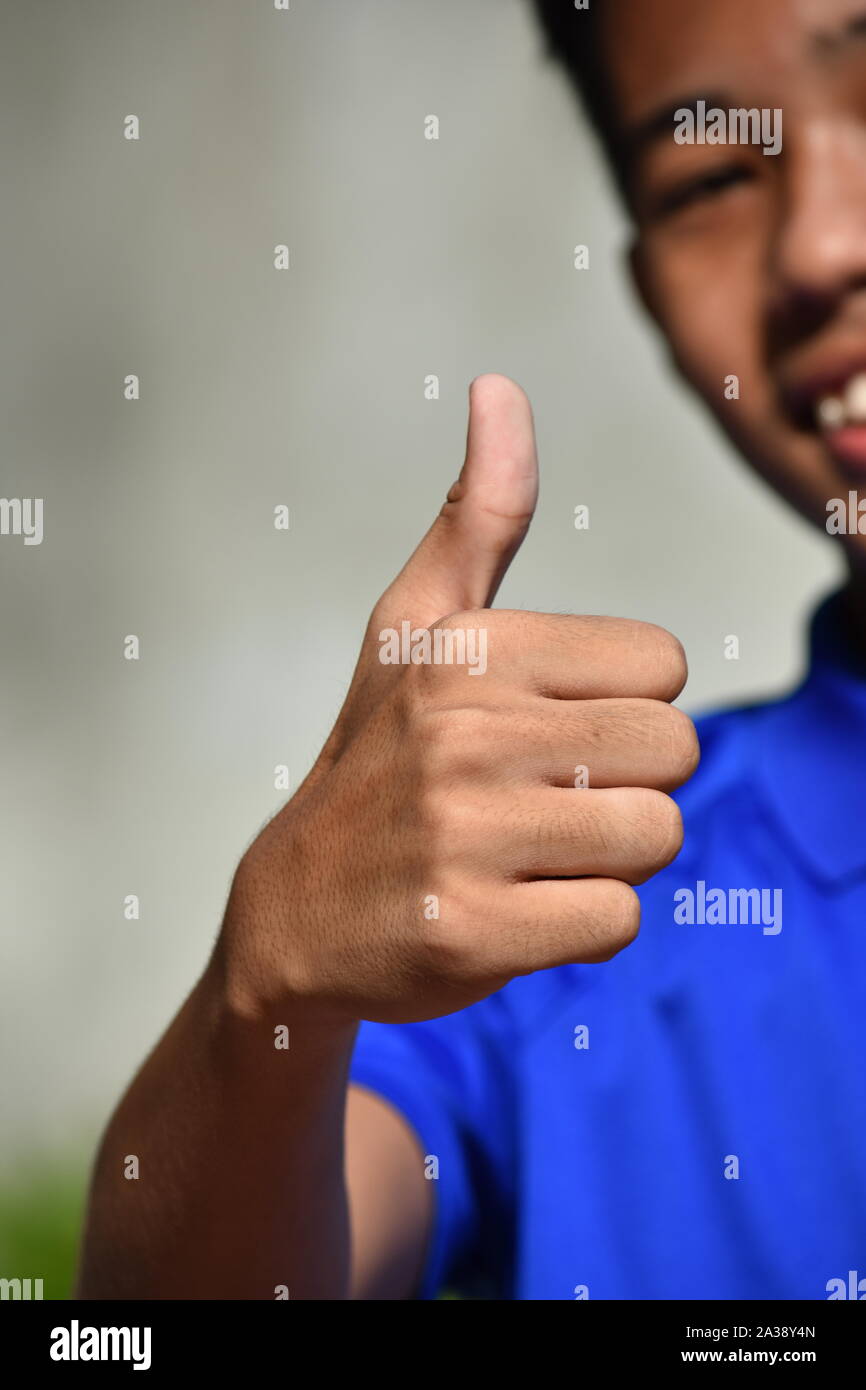 Minority Teenager Boy With Thumbs Up Stock Photo - Alamy