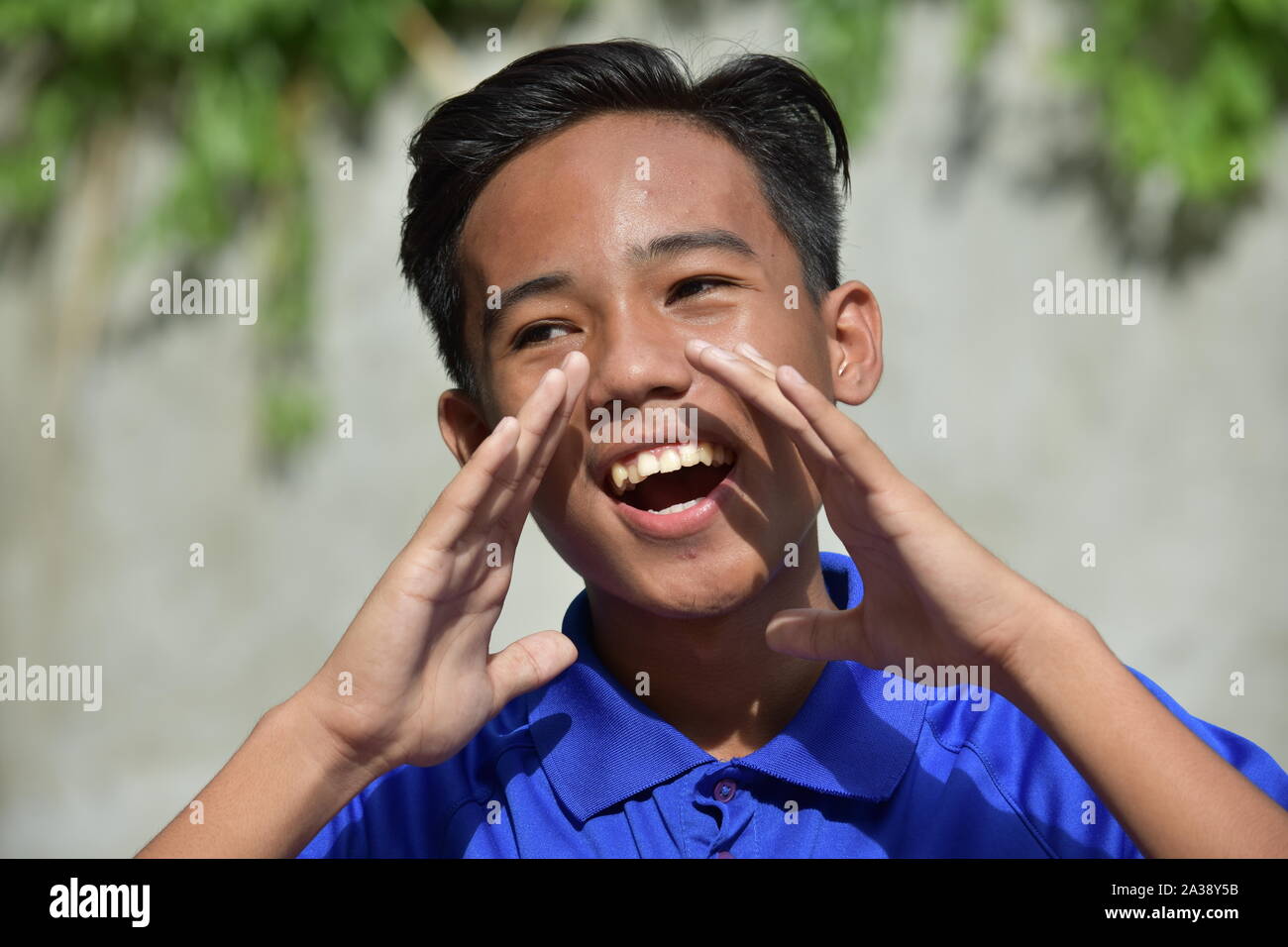 An A Talking Filipino Male Stock Photo - Alamy