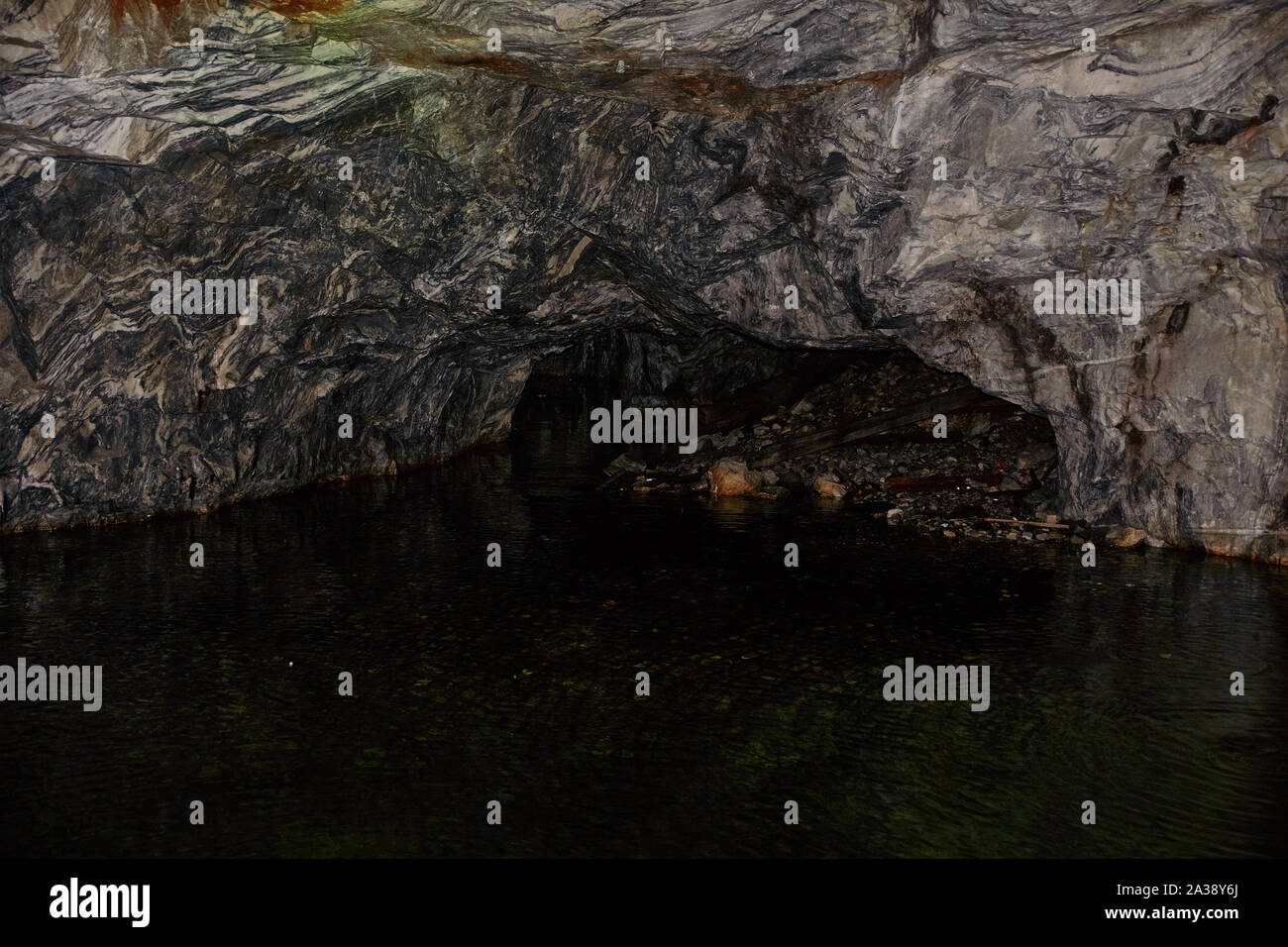 Types of a former underground marble quarry flooded with water. The ...