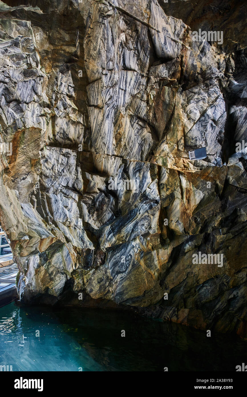 Types of a former underground marble quarry flooded with water. The ...