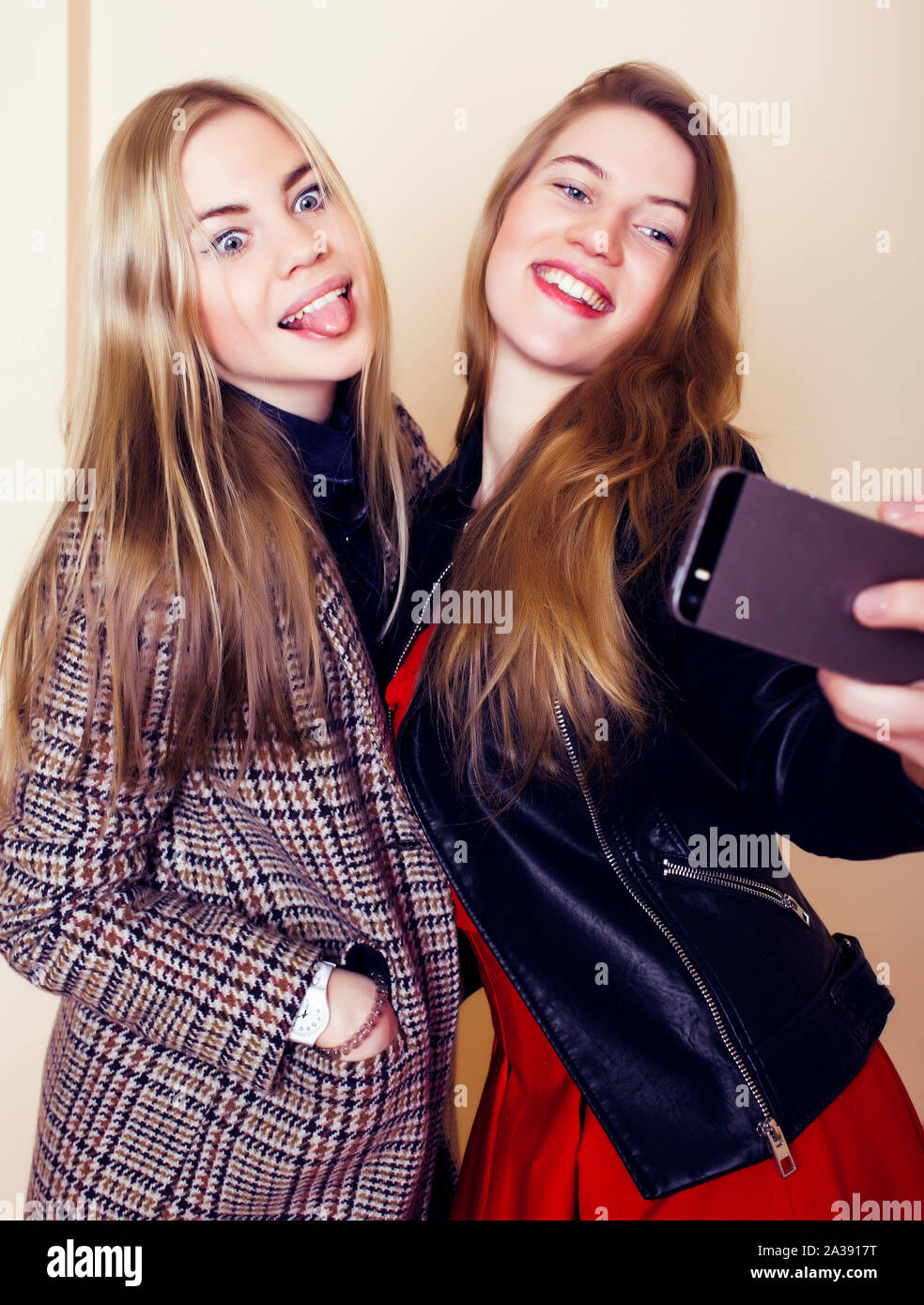 lifestyle and people concept: Fashion portrait of two stylish girls ...