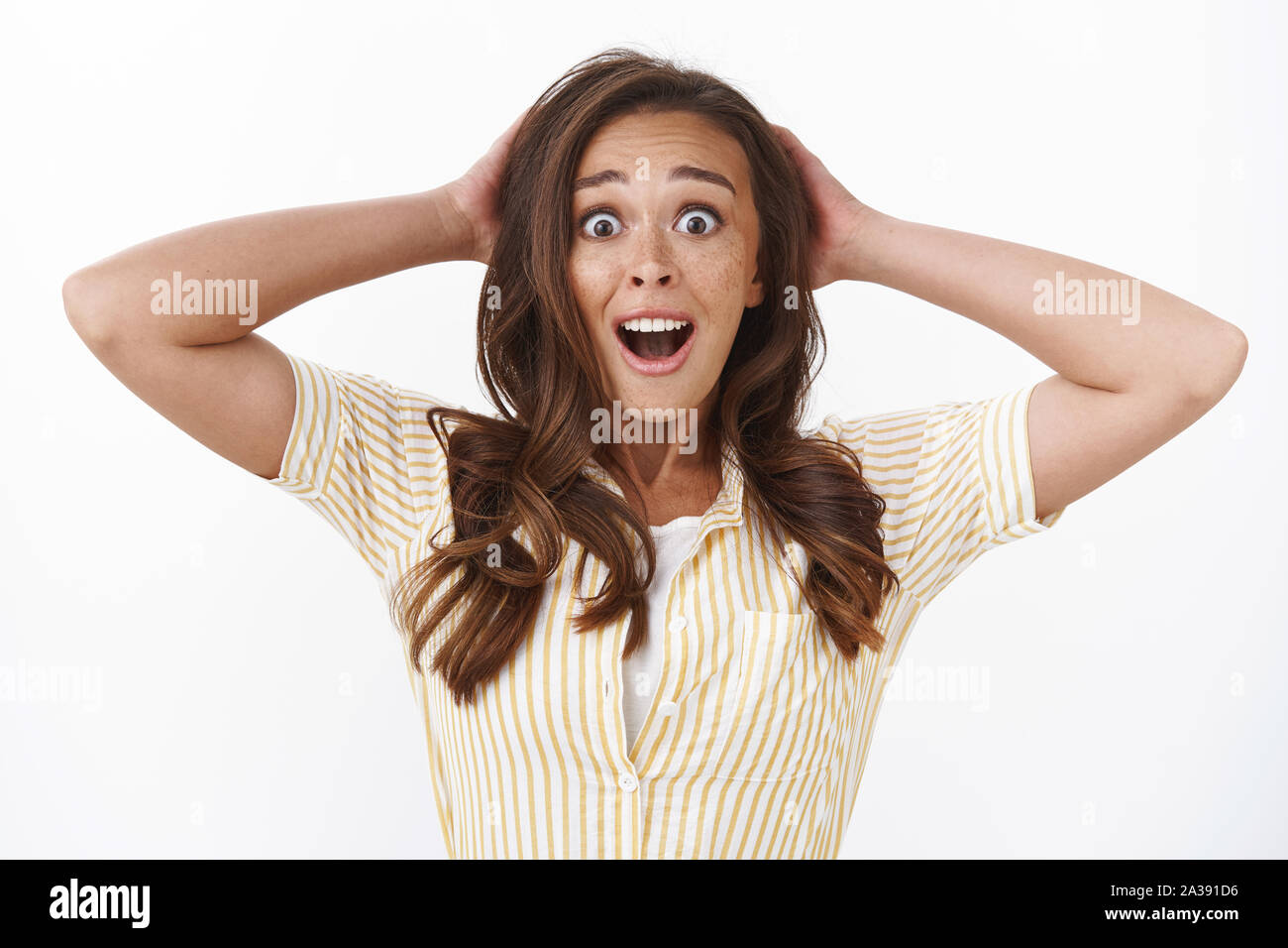 Close-up nervous surprised young woman with freckles, receive ...