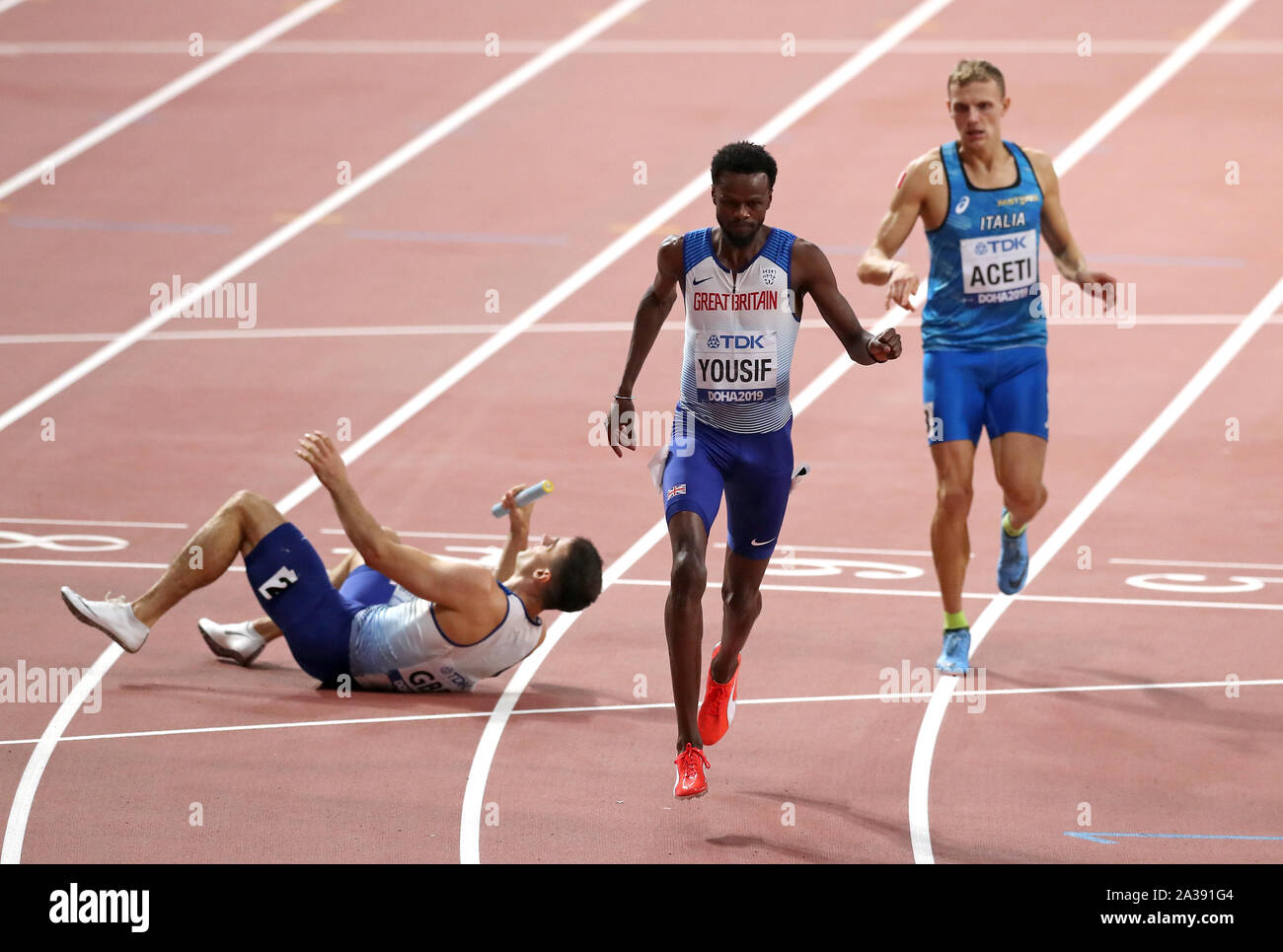 Great Britain's Rabah Yousif (right) and Toby Harries drop the baton ...