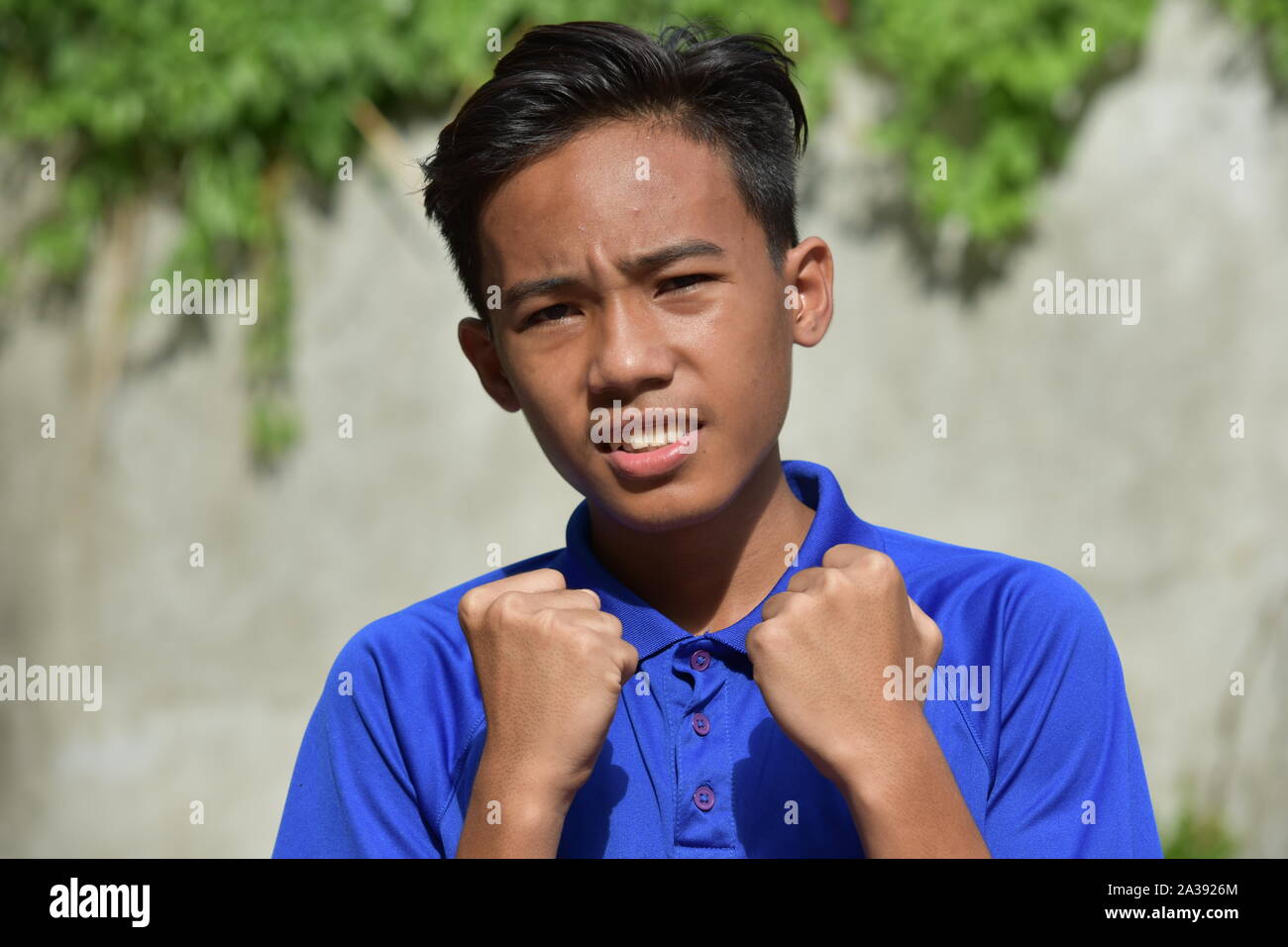 An An Angry Filipino Boy Stock Photo - Alamy