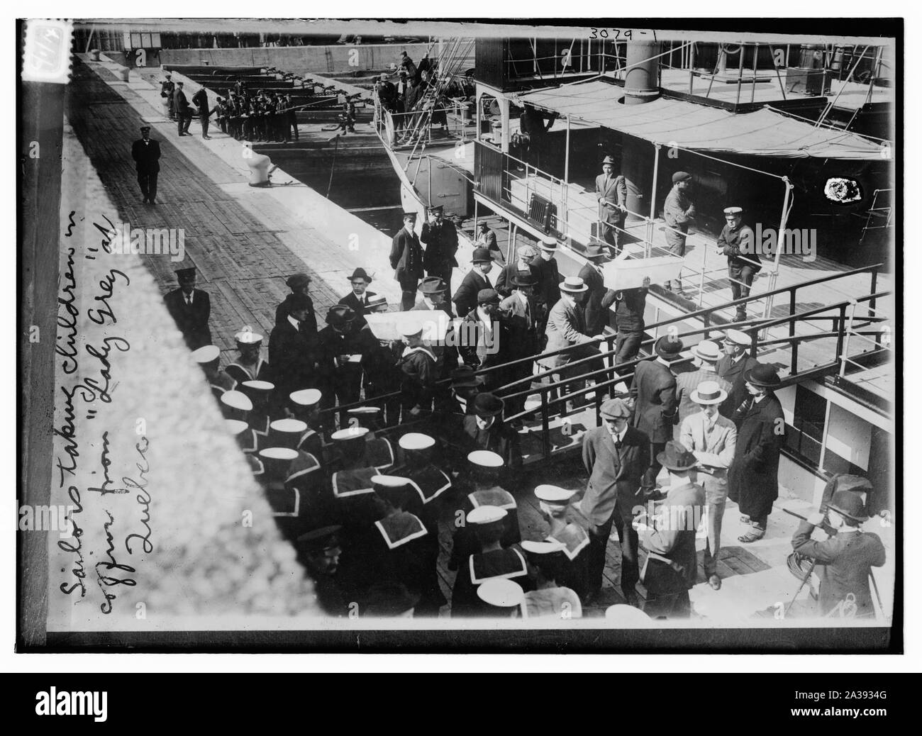 Sailors taking children in coffins from LADY GREY at Quebec Stock Photo ...