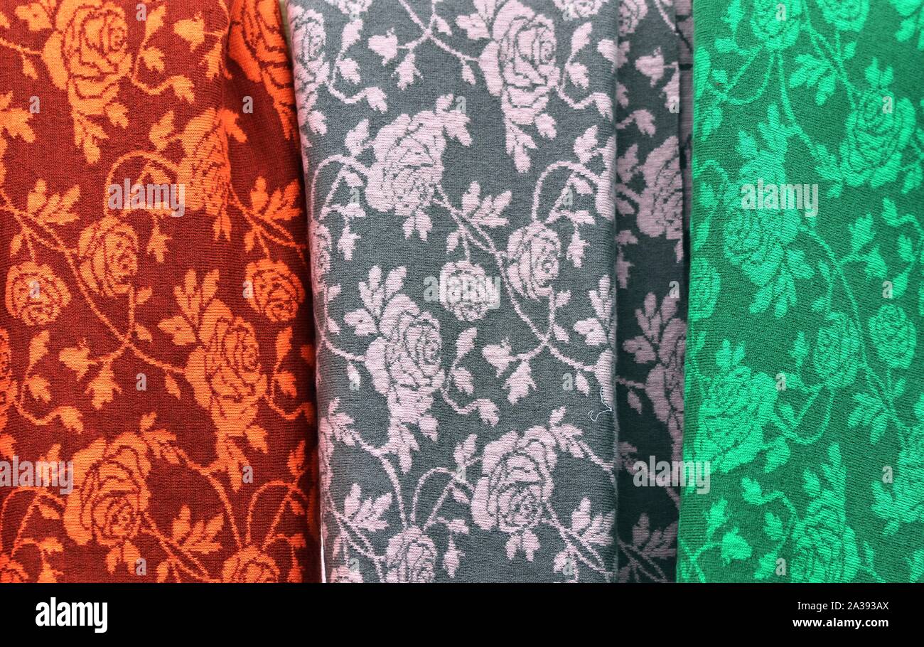 Highly detailed close up view on colorful textile and fabric textures ...