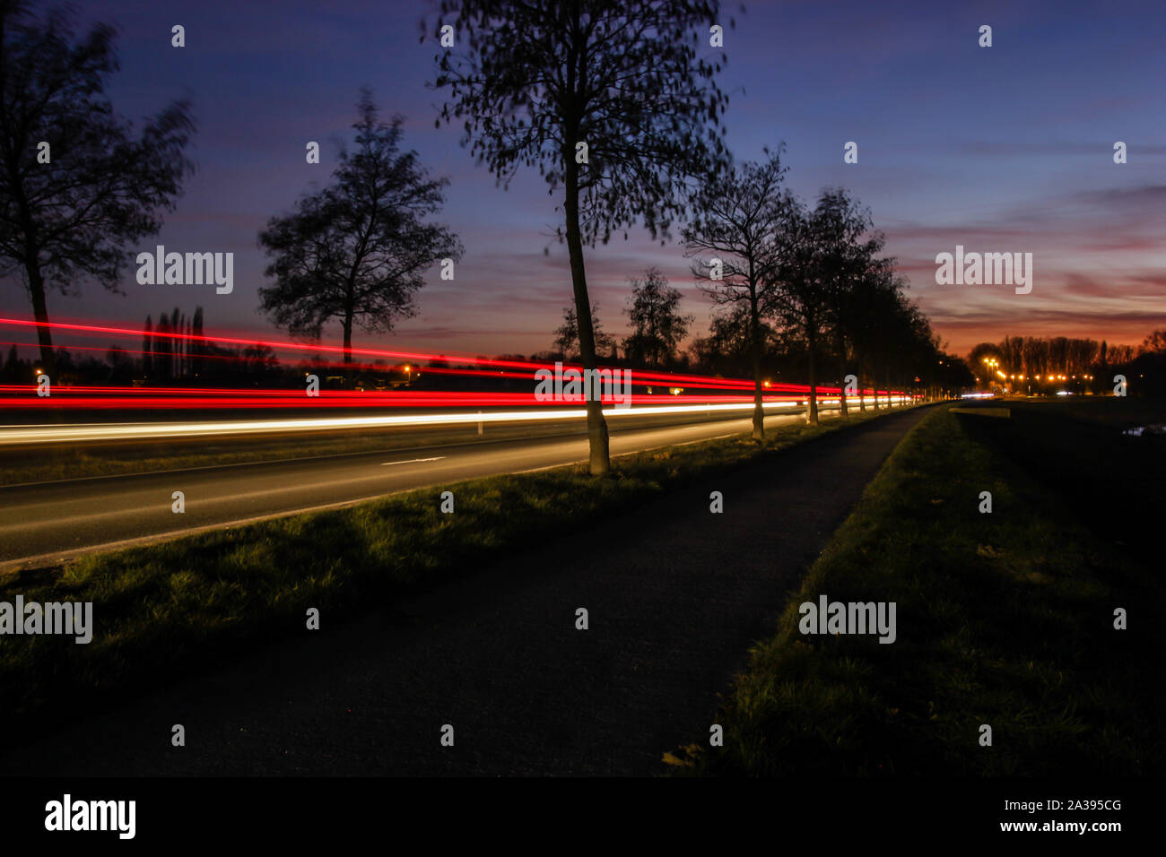 Cars driving by at high speed, long exposure of taillights and ...