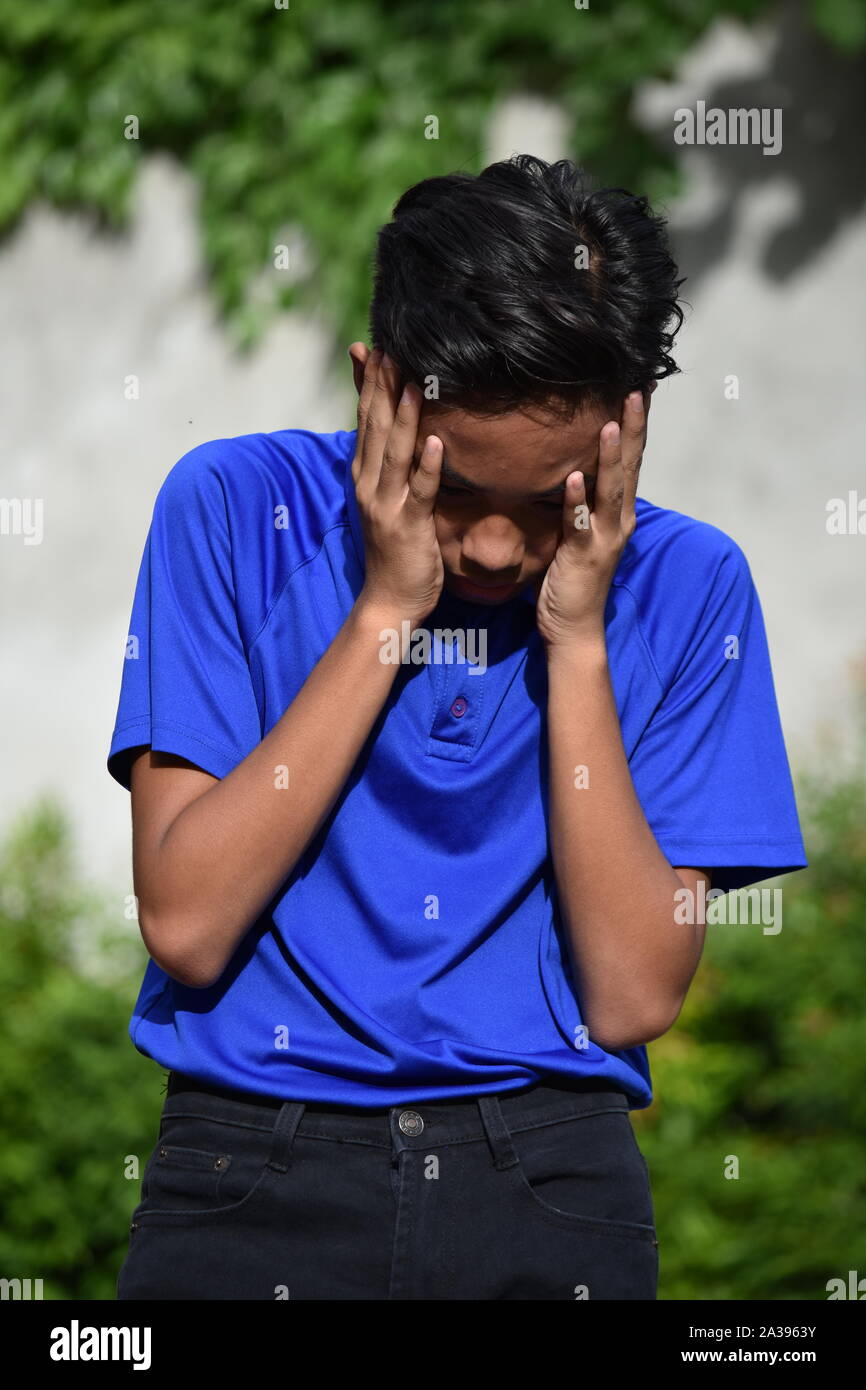 A Sad Handsome Asian Person Stock Photo - Alamy