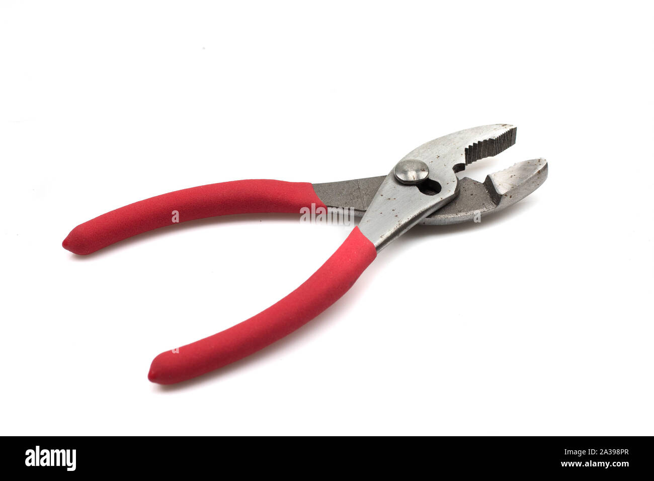A close up image of a pair of red handled pliers isolated on a white ...