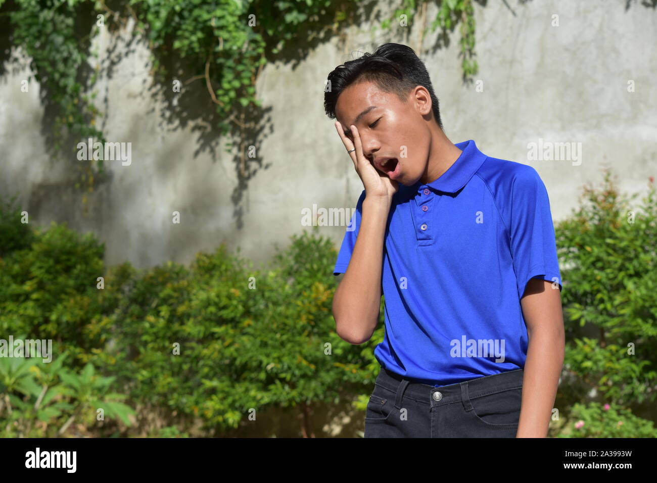 Sleepy Good Looking Filipino Teenager Boy Stock Photo - Alamy