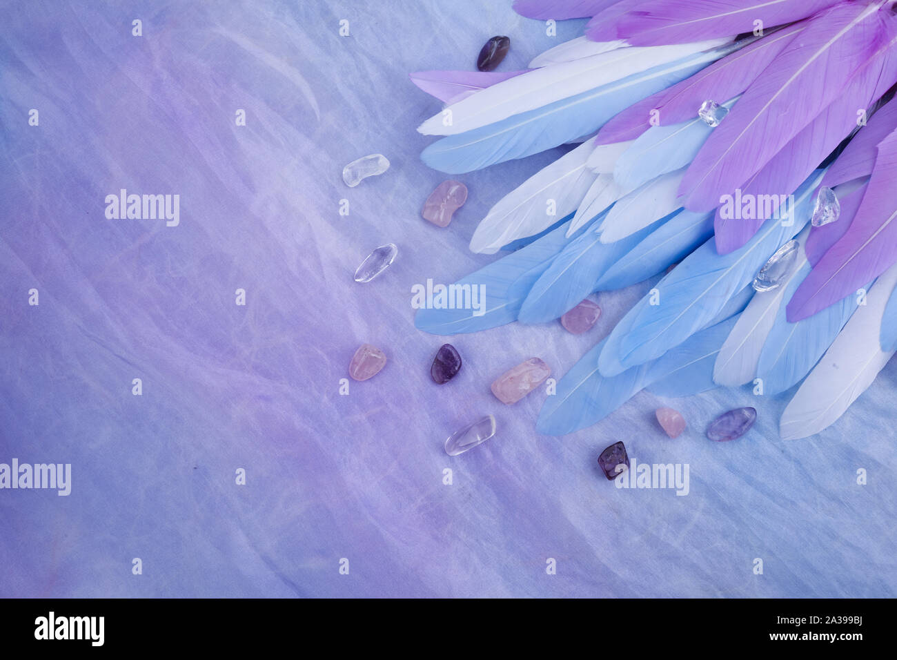 Angel Healing. Feather in the right corner on multi colored background ...