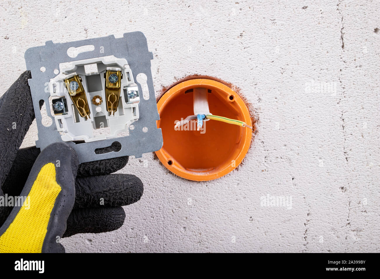 Installation of the electric socket in a rough wall. Installation of a ...