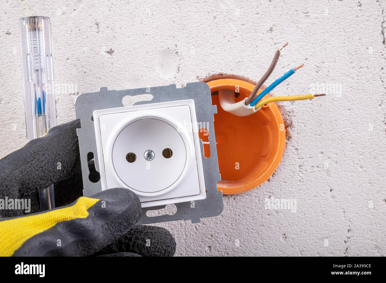 Installation of the electric socket in a rough wall. Installation of a ...