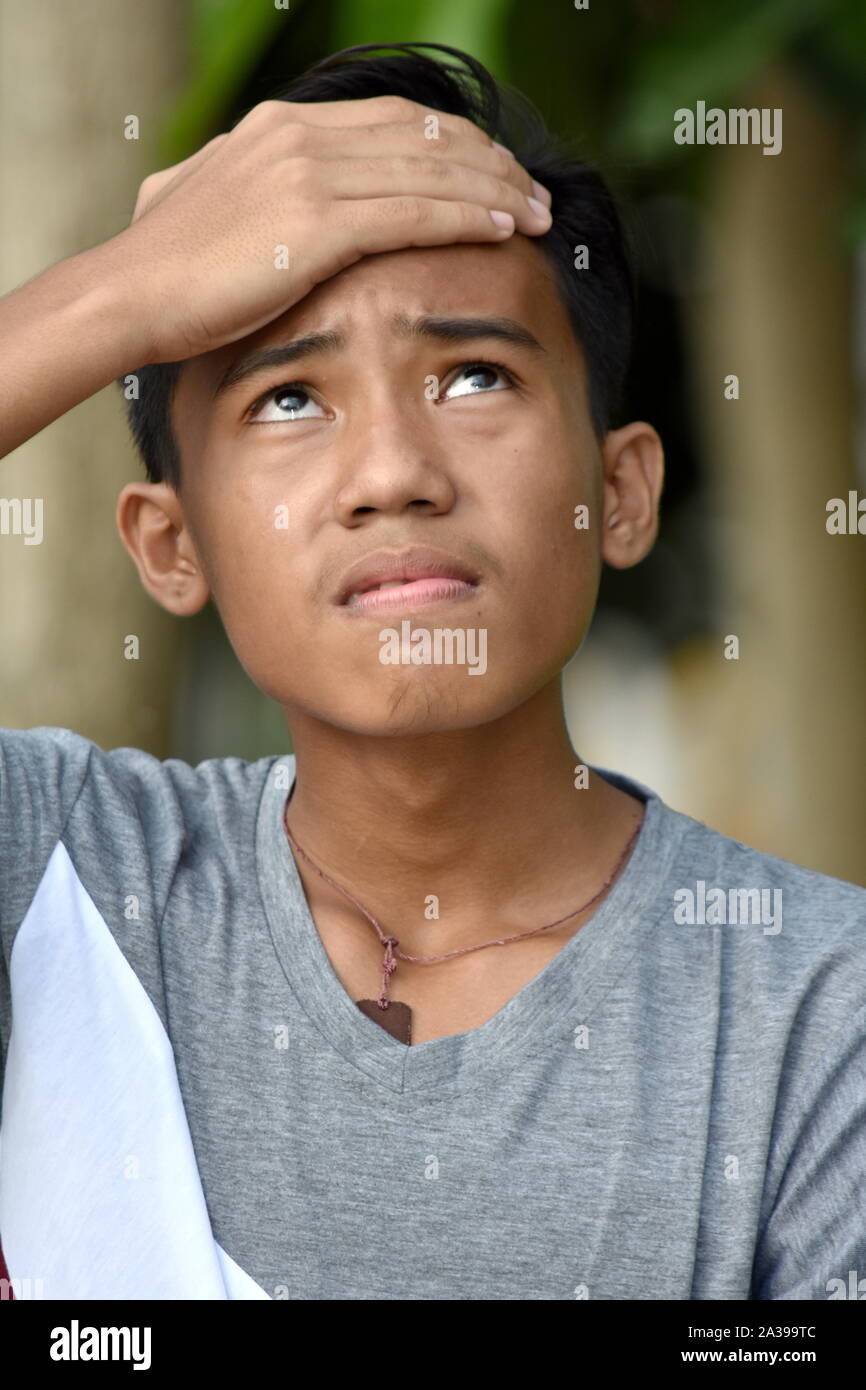 An A Forgetful Filipino Boy Stock Photo - Alamy