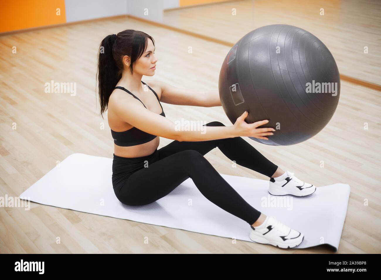 Healthy Lifestyle. Fitness woman doing exercises in gym Stock Photo - Alamy