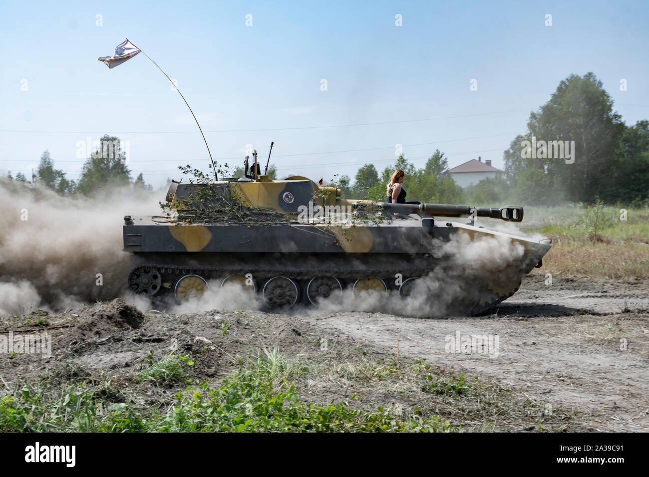 Fast ride of the Soviet 2S1 Gvozdika self-propelled howitzer with woman ...