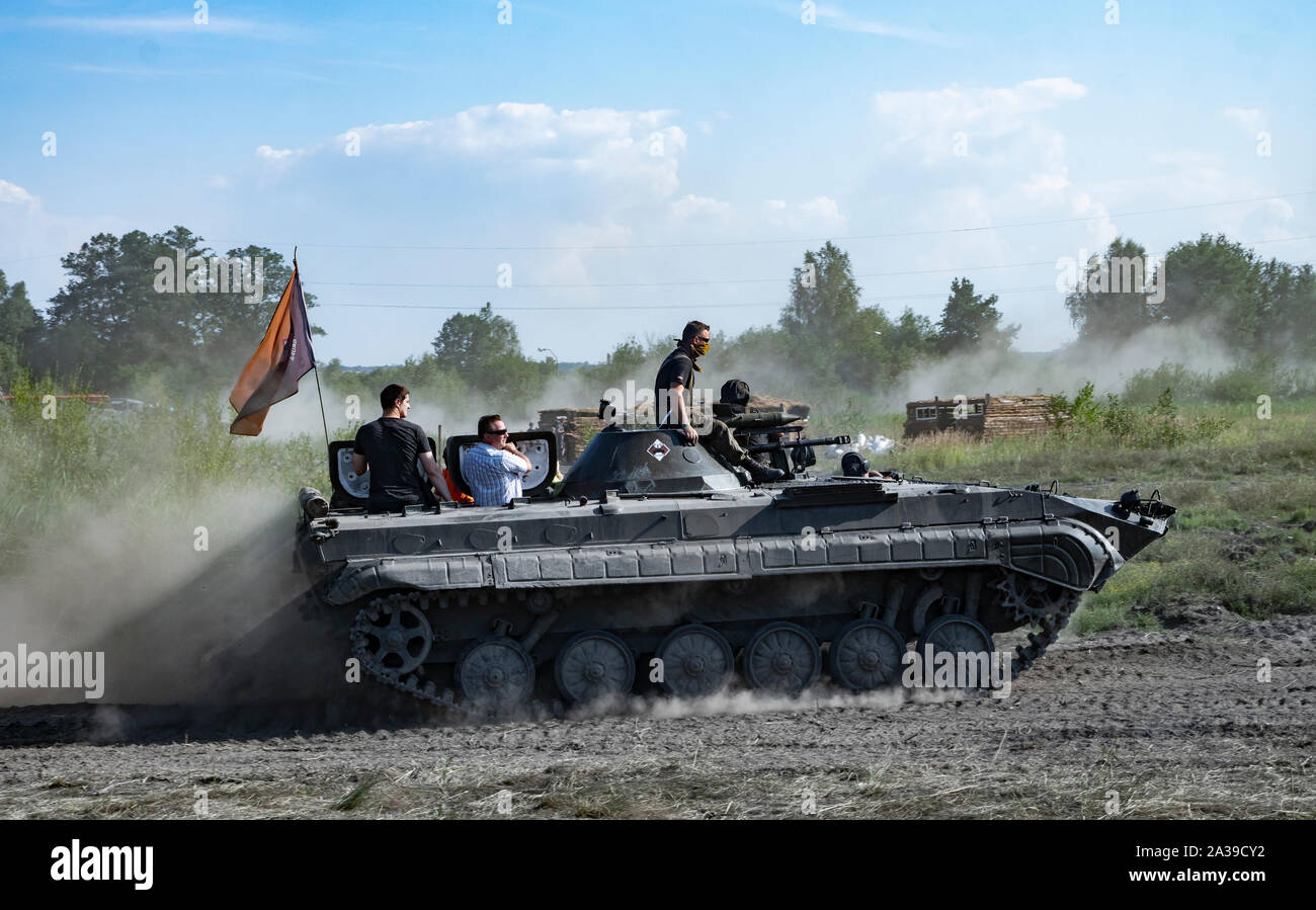 Fast ride of the Soviet BMP-1 infantry fighting vehicle with spectators ...