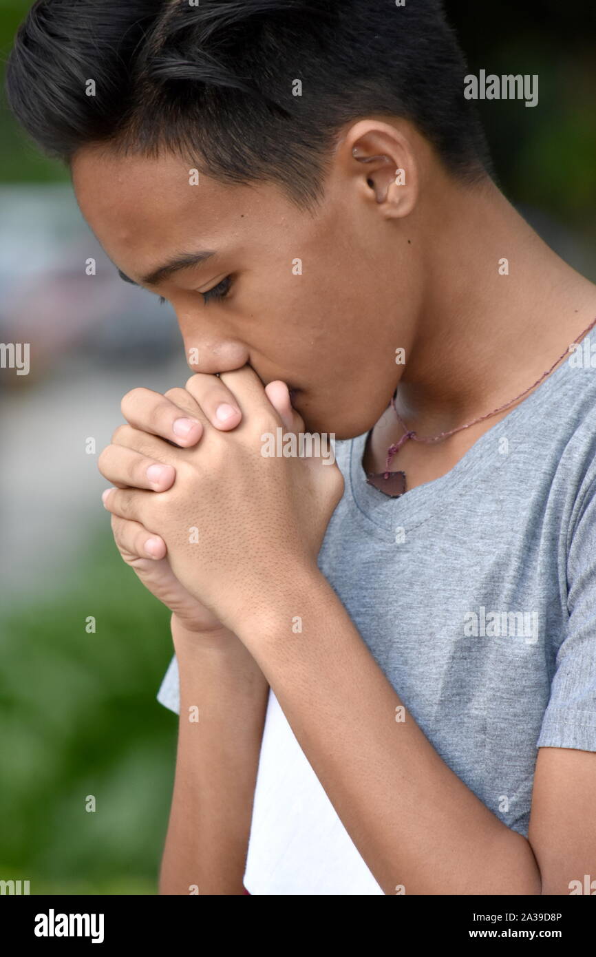 A Male Youngster Praying Stock Photo - Alamy