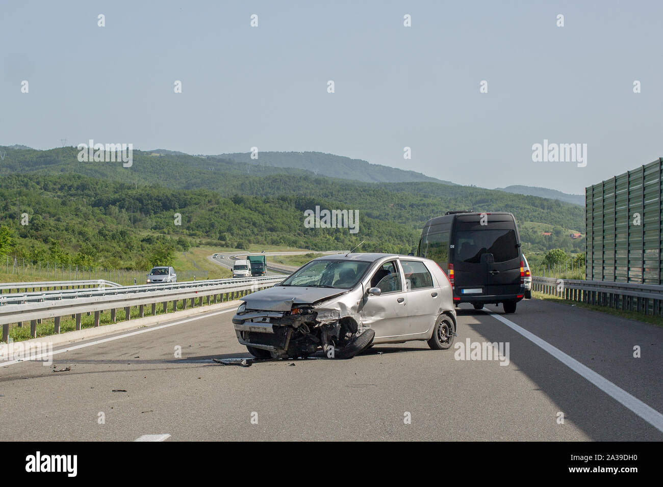 Car crash accident on the road, damaged car after collision is deployed ...