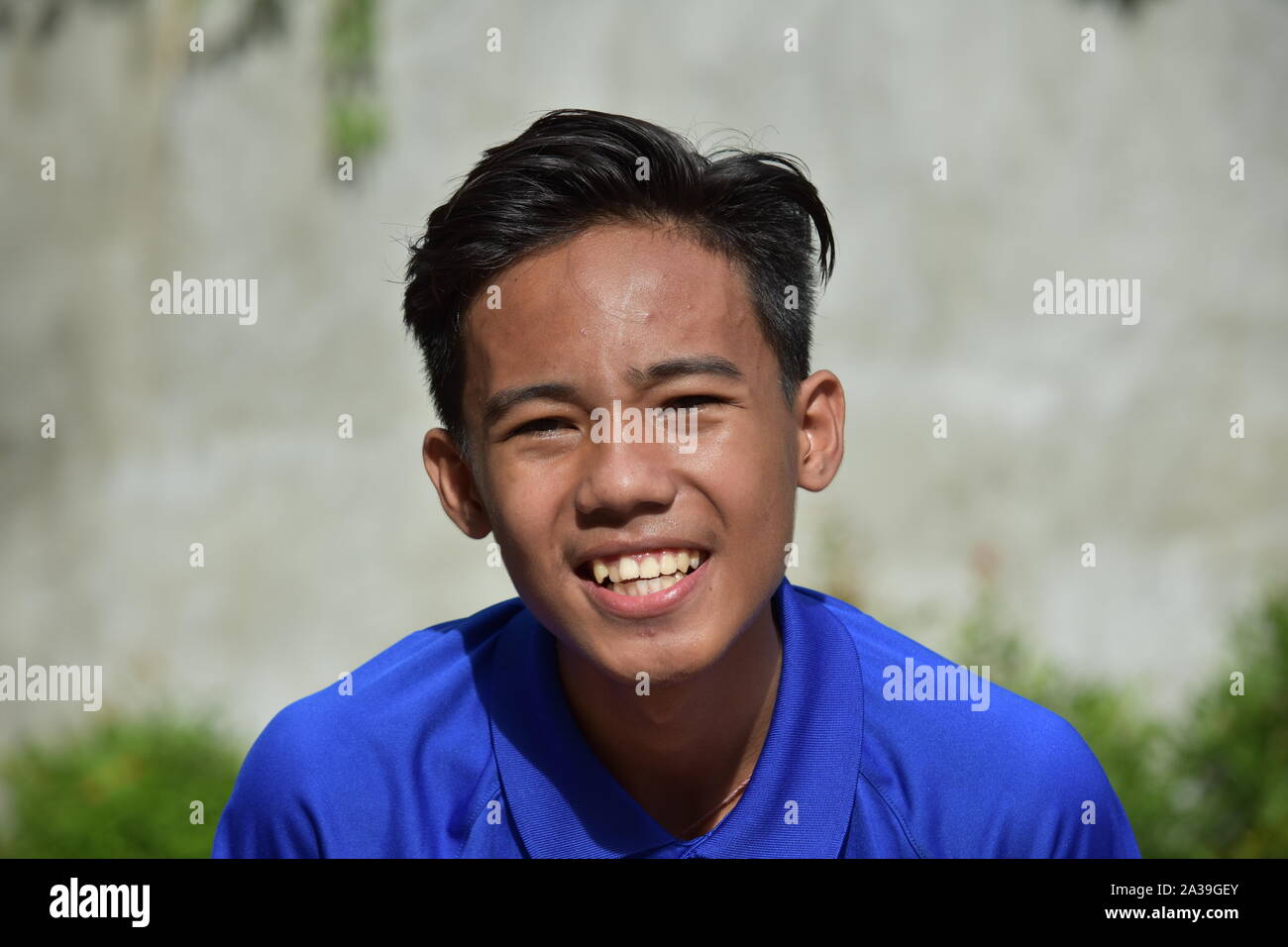 A Handsome Diverse Teenager Smiling Stock Photo - Alamy