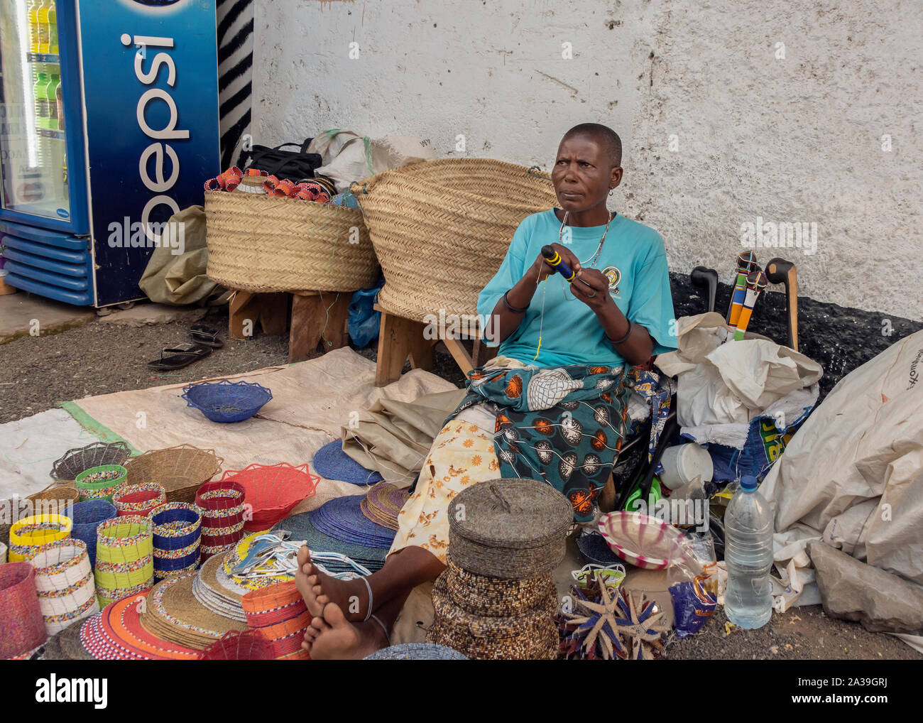 Woman doing beadwork at the Maasai Market, Arusha, Tanzania Stock Photo ...