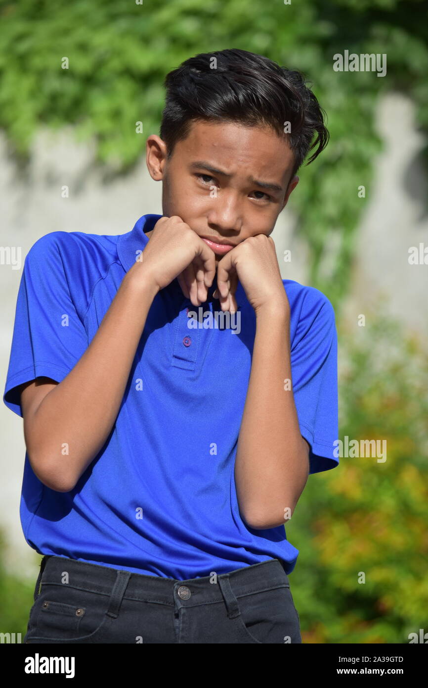 Sad asian boy hi-res stock photography and images - Alamy