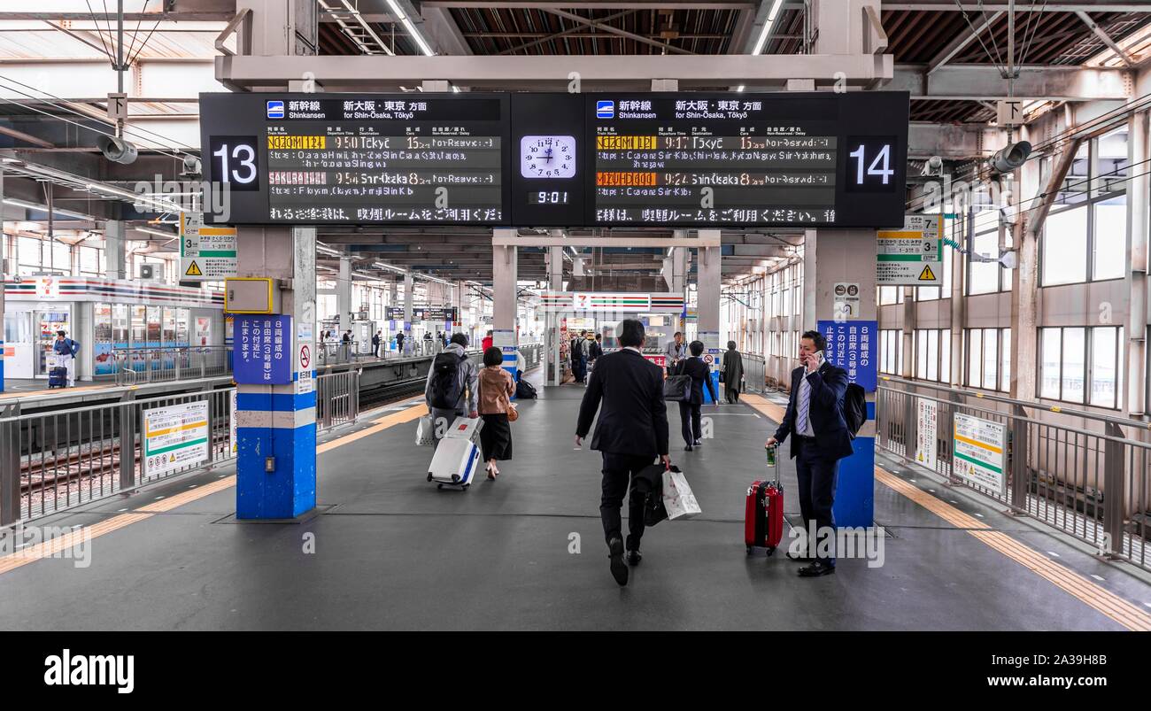 Passengers at platform, Japanese information display at high speed ...