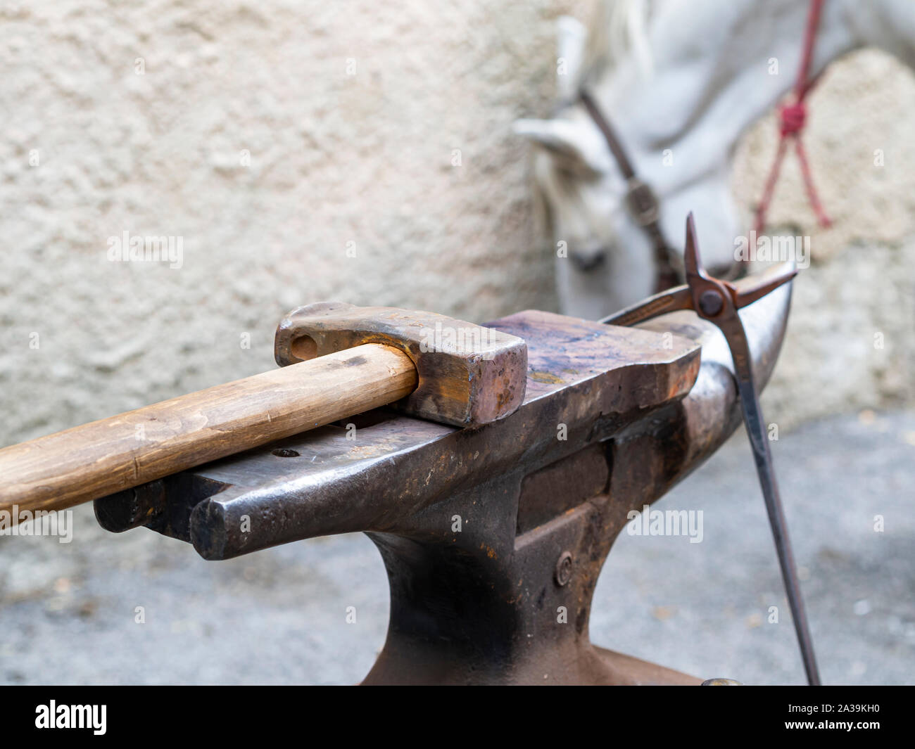Blacksmith tools details with an horse in background Stock Photo - Alamy