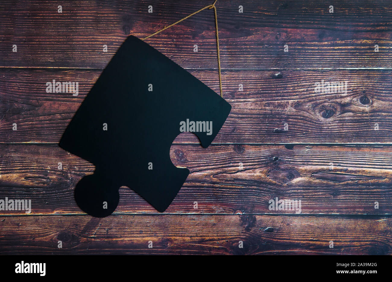 Puzzle piece on wooden background. Autism Spectrum Disorder (ASD ...