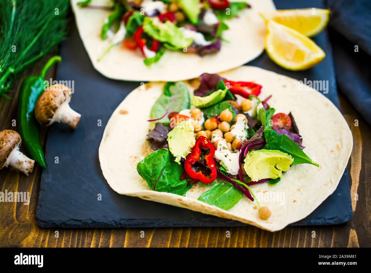 Vegan wraps with salad, chickpeas, vegetables and avocado, healthy ...