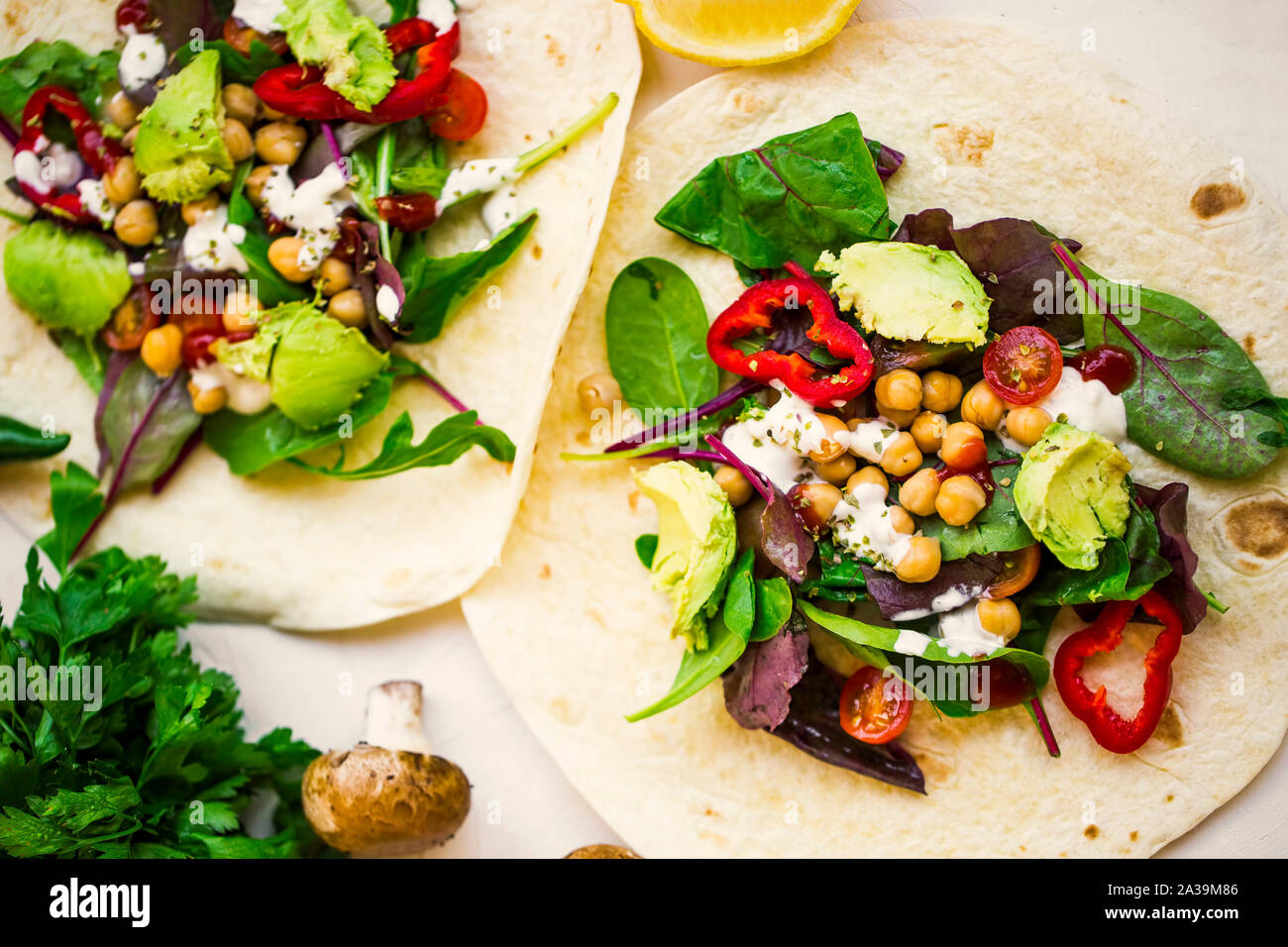 Vegan wraps with salad, chickpeas, vegetables and avocado, healthy ...