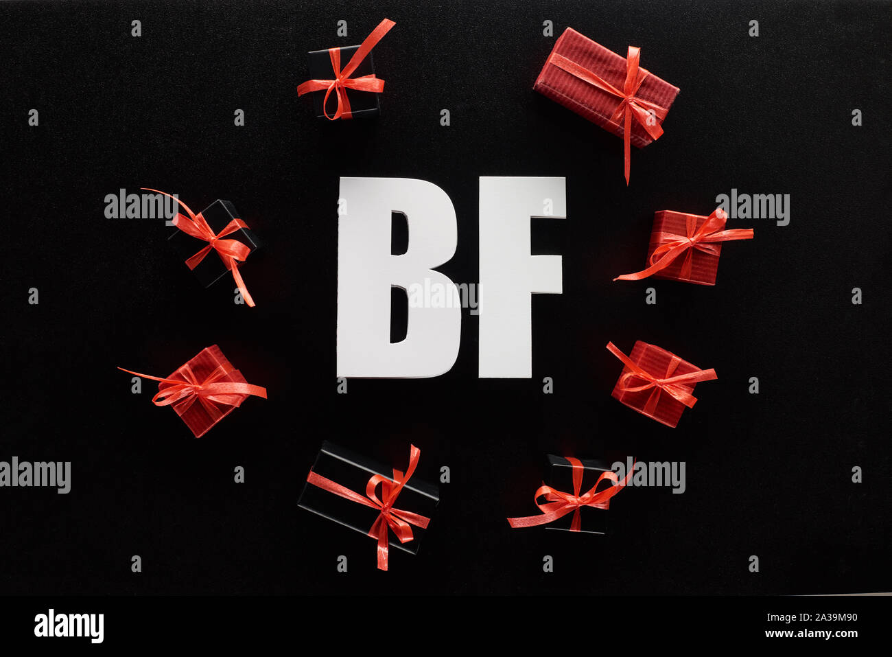 top view of BF lettering with red presents isolated on black Stock ...