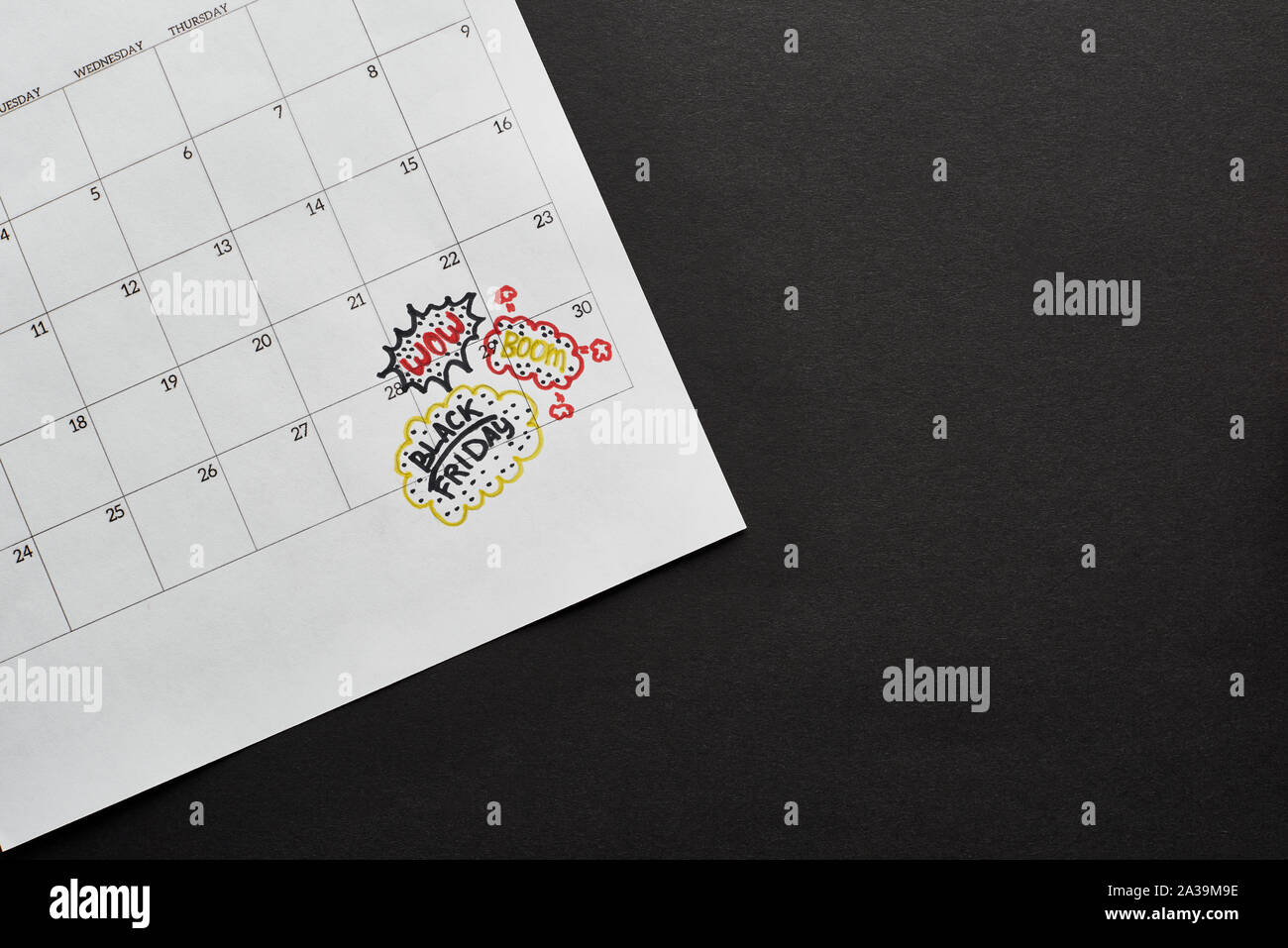 top view of calendar with black Friday marked date on black background ...