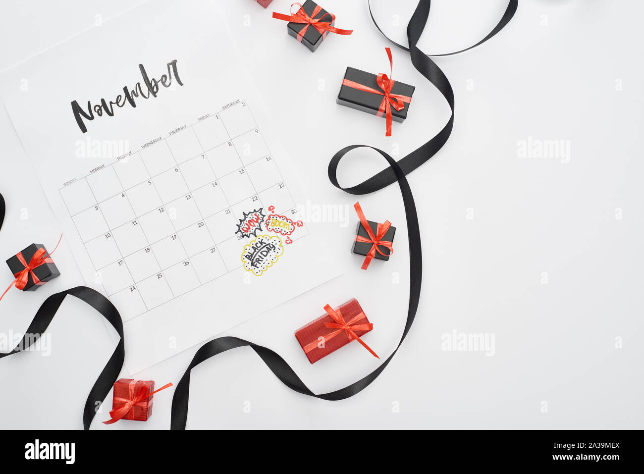 top view of calendar with November 29 marked date on white background ...